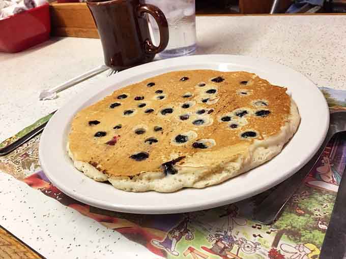 Blueberries studded throughout a pancake the size of your head, because subtlety is overrated at breakfast.