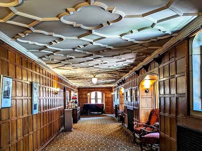 This ornate ceiling work proves that hallways can be destinations, not just ways to get somewhere else.