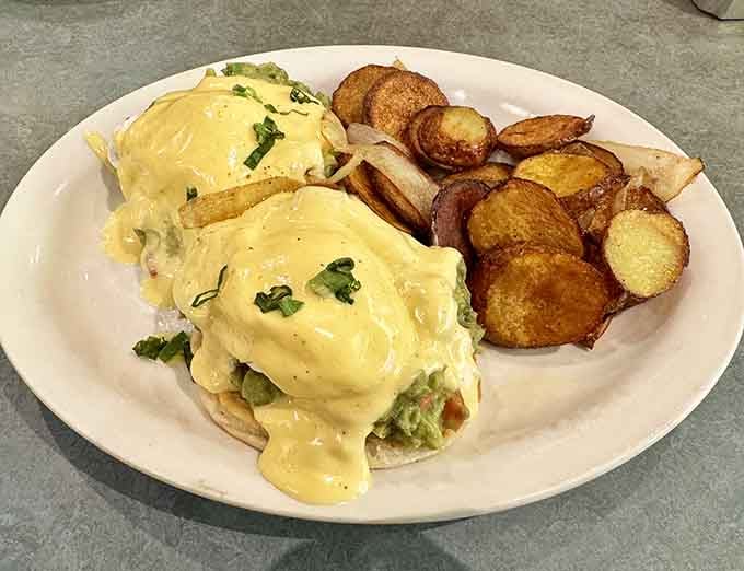 Hollandaise cascading over perfectly poached eggs&mdash;it's like watching edible gold drip onto your morning happiness.