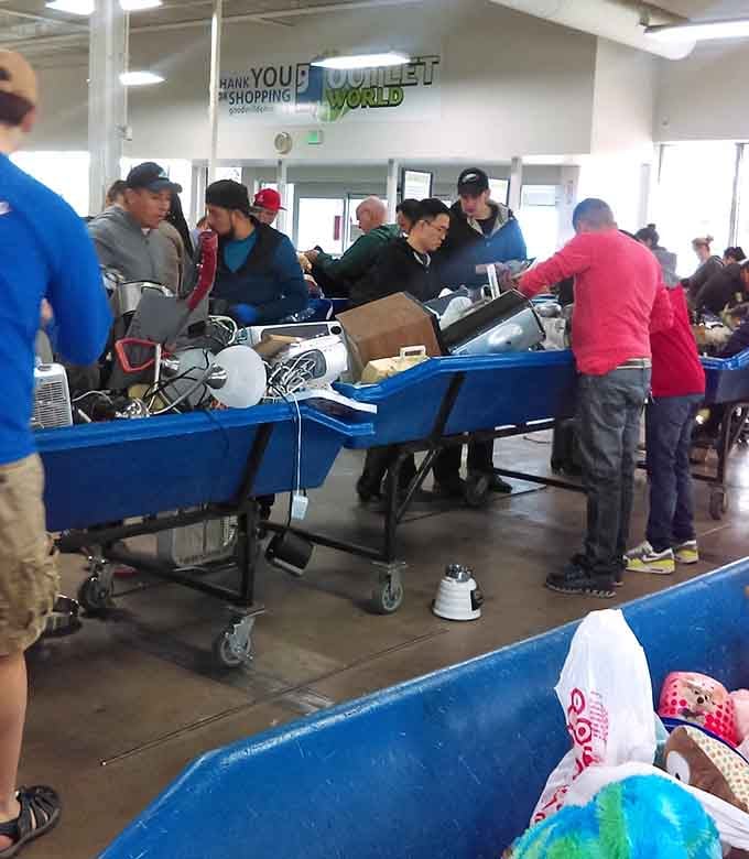 Shoppers gather around fresh bins like treasure hunters at a newly discovered site, ready to explore.