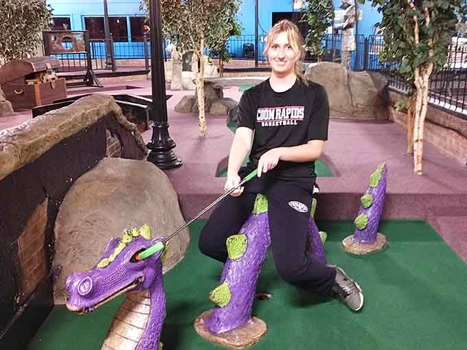 This visitor's about to discover that purple dinosaur obstacles are trickier than they look on television.