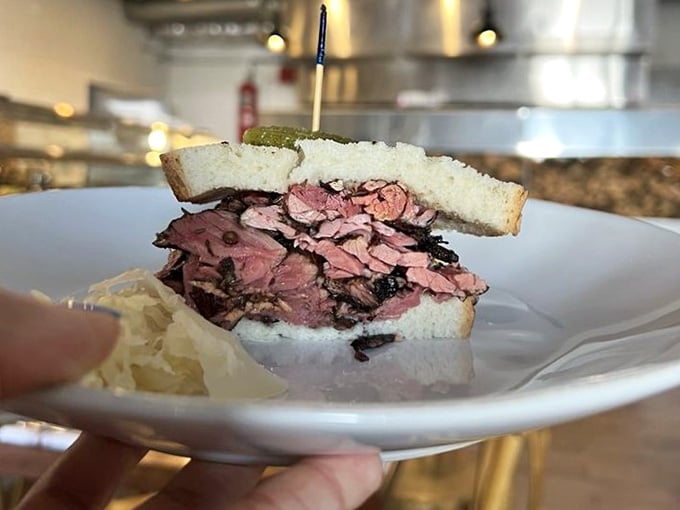 House-smoked pastrami piled so high it needs its own zip code and possibly structural engineering consultation.