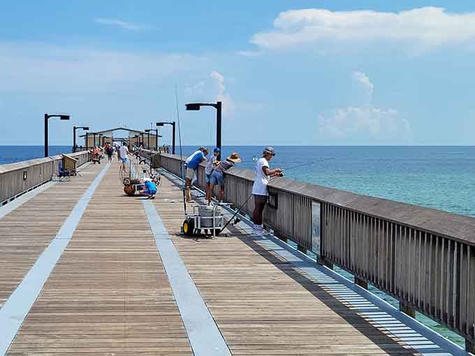 Anglers line the pier hoping for the big one while pelicans show them how it's really done.