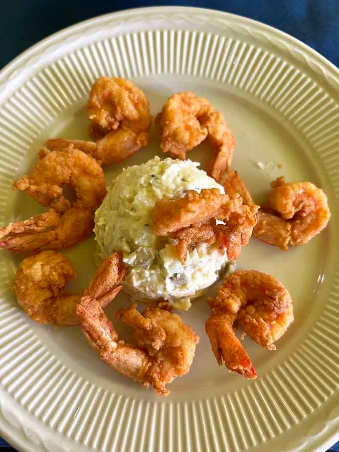Golden fried shrimp arranged like edible art, proving that sometimes the simplest presentations are the most mouthwatering and memorable ones.