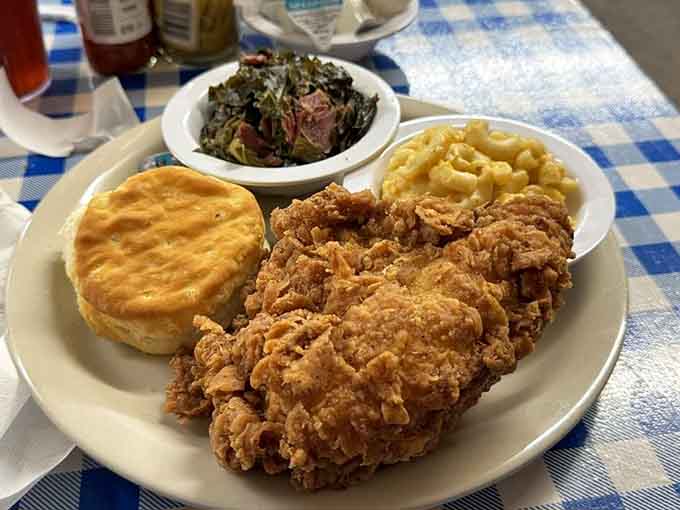 Fried chicken so perfectly golden it practically glows, flanked by mac and cheese that understands its life's purpose.