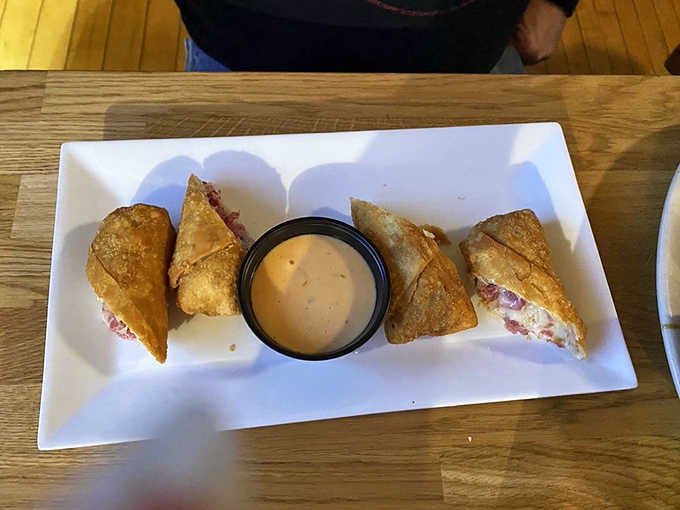 Golden egg rolls arrive with dipping sauce, crispy on the outside and packed with flavor inside every bite.