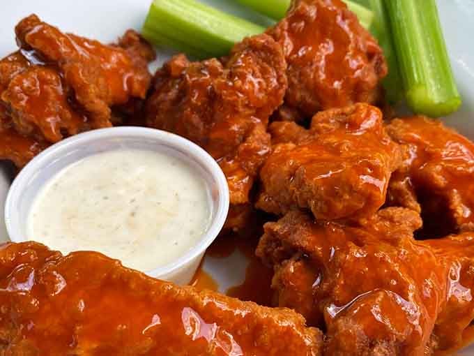 Buffalo wings done right &ndash; crispy, saucy, and served with celery that's really just an edible napkin.
