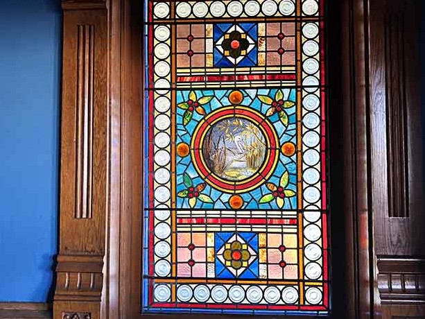 Stained glass that turns sunlight into art, because plain windows were apparently too boring for the 1880s.