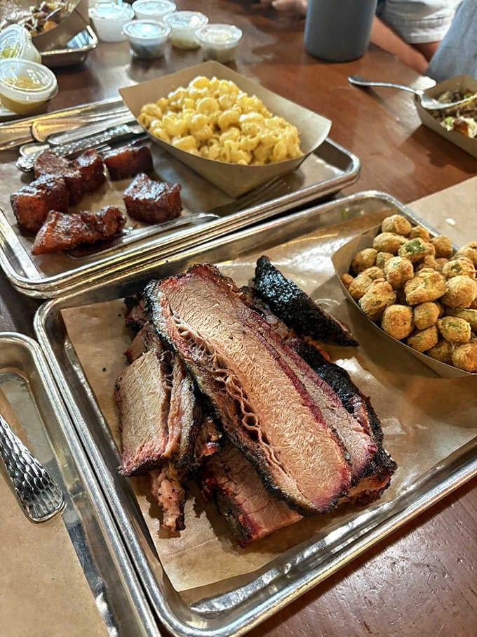 That smoke ring and bark on the brisket prove patience and fire create beautiful things together.