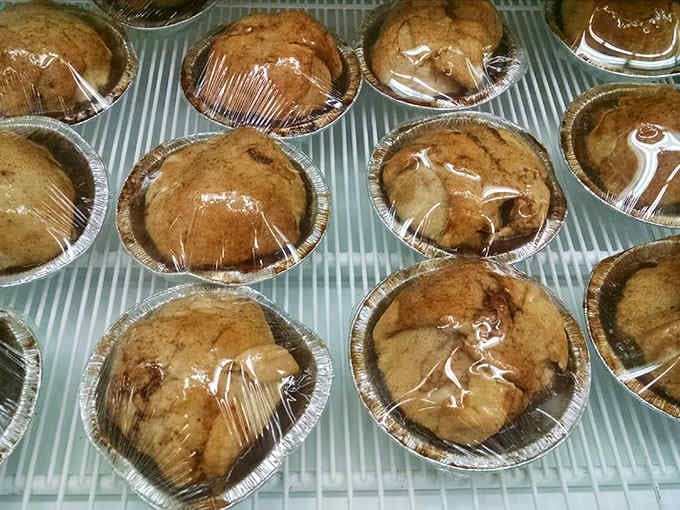 Individual pies wrapped and ready prove that personal-sized desserts are humanity's greatest invention after the wheel.