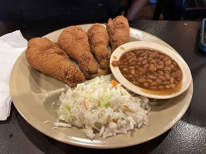 Those drumsticks come with beans and slaw, proving that sometimes the classics need zero improvement whatsoever.