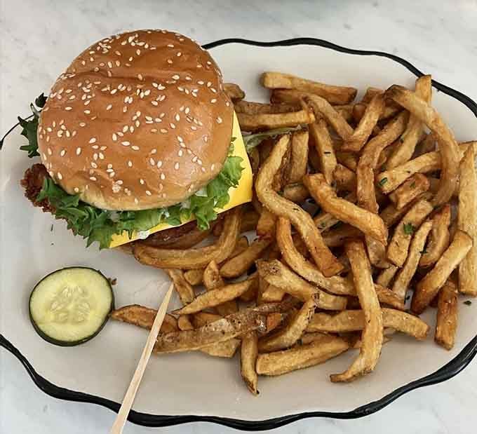 That sesame seed bun and mountain of golden fries prove sometimes simple done right beats fancy every time.
