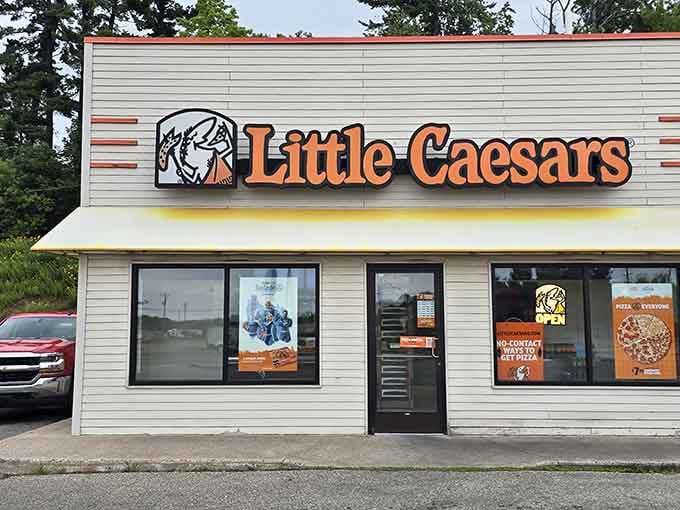 Little Caesars found its way here too, because even charming towns need pizza on speed dial.