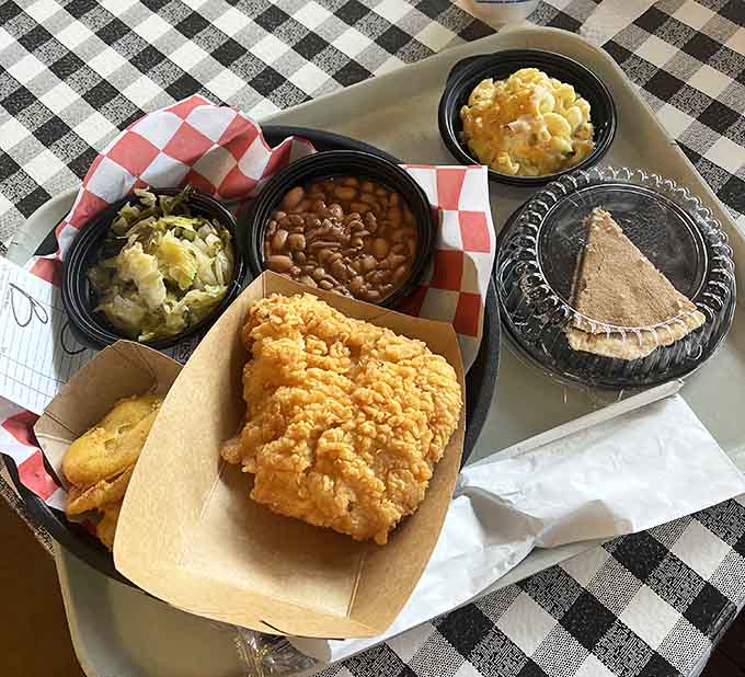 This tray of fried chicken and sides looks like someone bottled up Sunday dinner and served it with extra love.