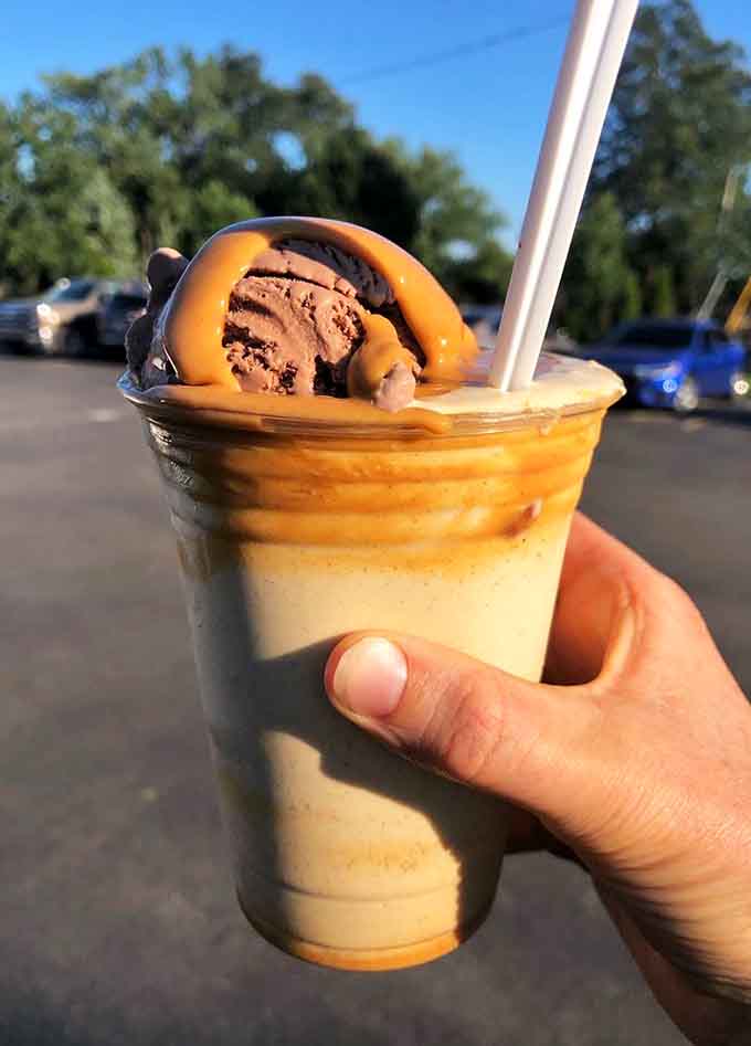 Peanut butter, caramel, and enough ice cream to require architectural support. This is engineering at its finest.