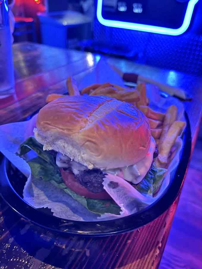 This burger under moody lighting looks like it's ready for its close-up, and honestly, it deserves one.