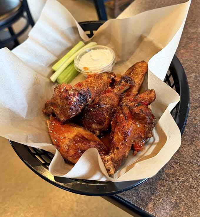 Wings with that perfect char and a side of celery, because even barbecue joints know you need your vegetables.