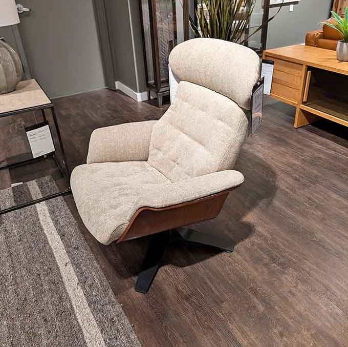 That cream swivel chair looks comfier than your current relationship with your couch, and it rotates too.
