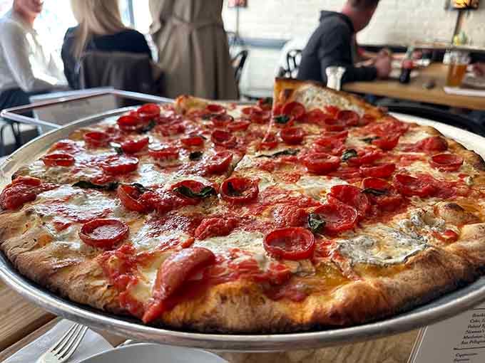 Pepperoni cups curling at the edges like tiny edible bowls catching pools of flavor.