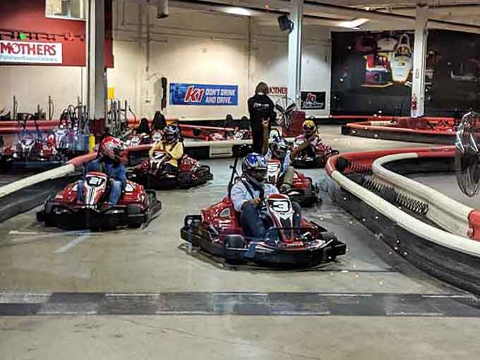 Electric karts line up like eager racehorses at the gate, ready to transform cautious drivers into fearless competitors.