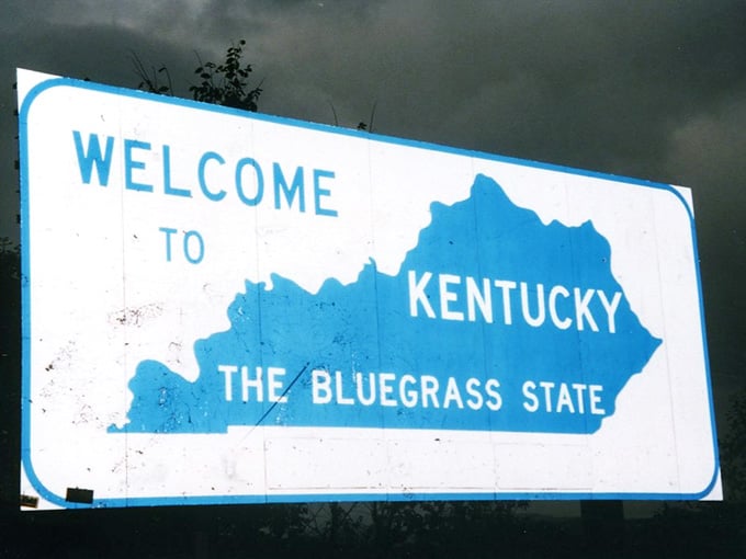 This vintage sign's weathered patina tells stories of countless homecomings and road trips through the decades.