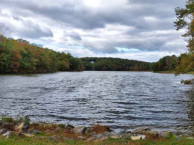 Macedonia Brook State Park's lake reflects autumn colors so perfectly you'll wonder if nature has an Instagram filter setting.