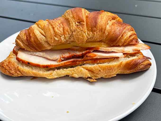 A flaky croissant stuffed with turkey and gouda is basically a warm hug in sandwich form, perfect any time.