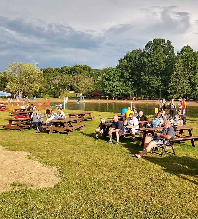 Picnic tables filled with happy families prove that simple pleasures never go out of style, especially in summer.
