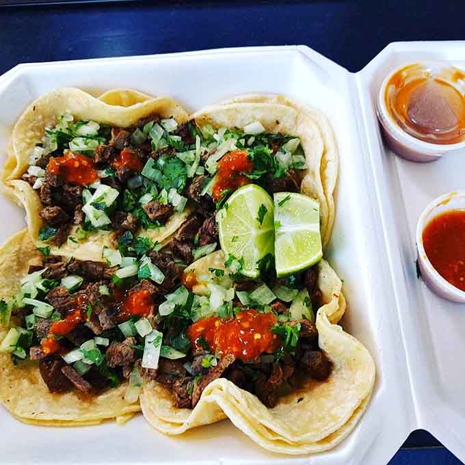 Carne asada tacos showcase chopped steak that's tender, well-seasoned, and piled high on soft, fresh tortillas.