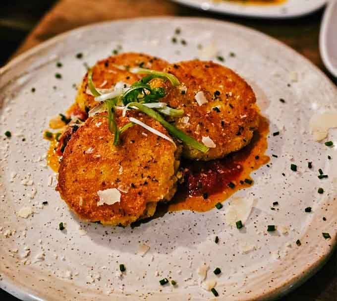 Golden arancini balls prove that risotto's second act might actually be better than its debut performance on your plate.