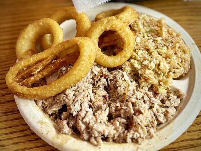 Chopped barbecue with onion rings is the kind of plate that makes you forget your own name temporarily.