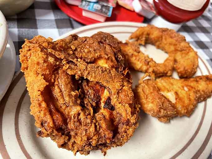 Fried chicken with a crust so perfect it should be teaching masterclasses to every fast-food joint in America.