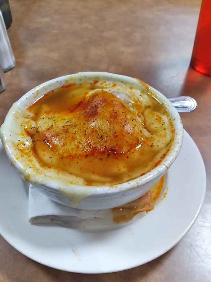 French onion soup with that perfectly melted cheese blanket that makes you forget your troubles temporarily.