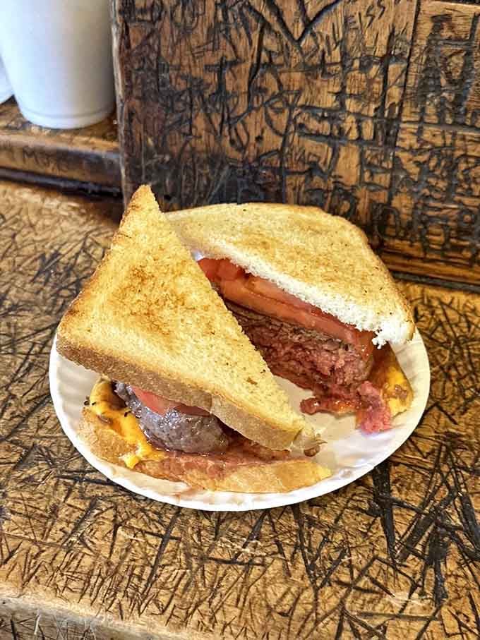 Two slices of toast cradling perfectly cooked beef, this is what burgers looked like before buns took over America.