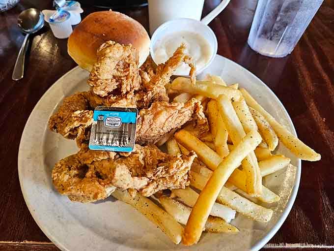 Crispy chicken tenders piled high with perfectly seasoned fries make you remember why this combination never goes out of style.