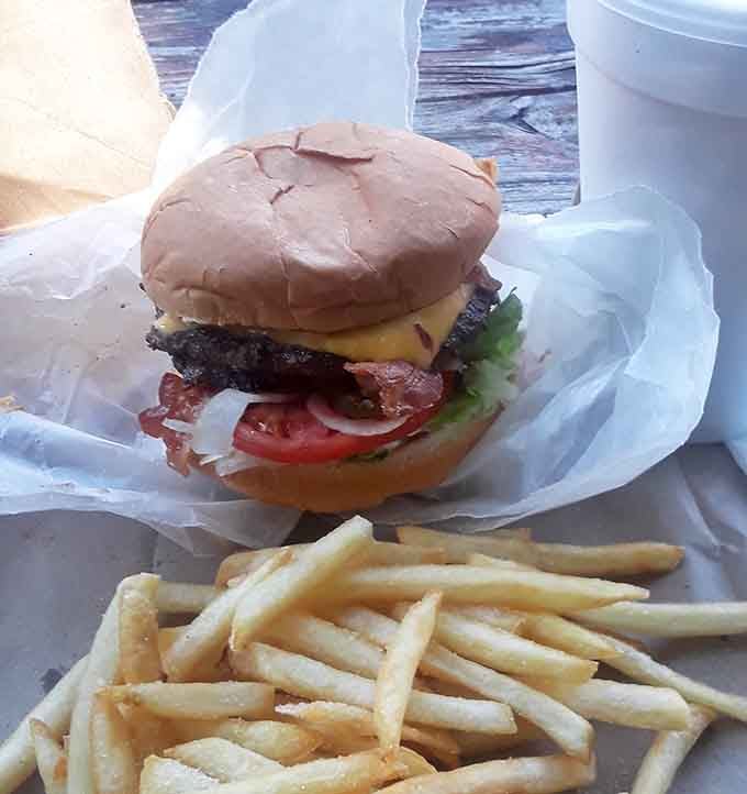 This is what lunch should look like: a proper burger, a mountain of fries, pure satisfaction.