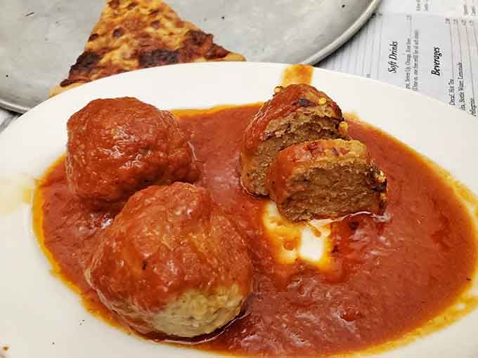 Meatballs swimming in sauce like they're auditioning for an Italian comfort food hall of fame.