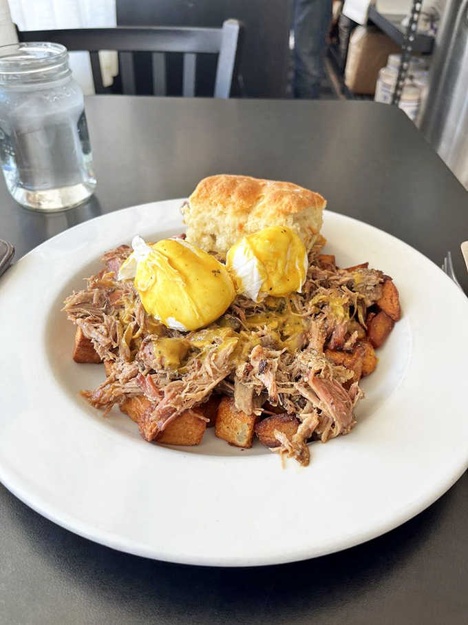 Pulled pork hash topped with eggs and a biscuit: breakfast's answer to "go big or go home."