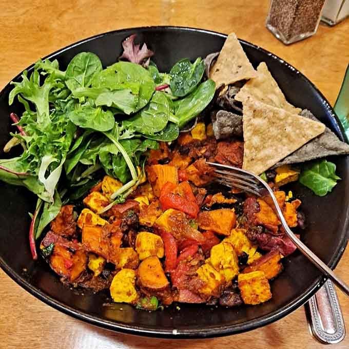 Roasted sweet potatoes and greens create a colorful plate that's as nutritious as it is Instagram-worthy, proving vegetables belong at breakfast.