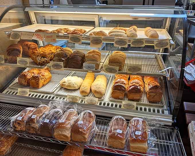 Fresh pastries and croissants tempt you before you've even reached the cheese, a delicious strategic ambush.