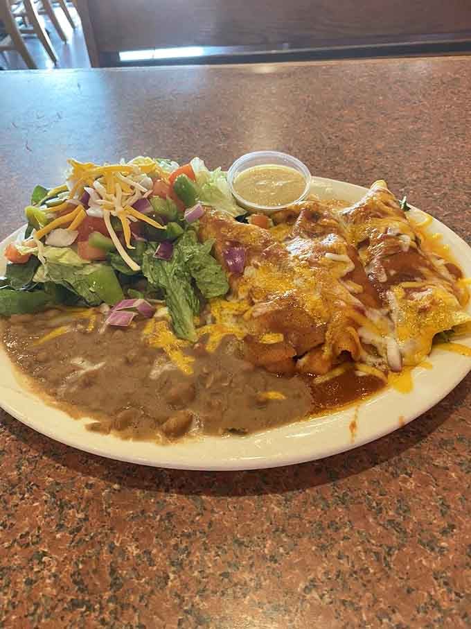 Seafood enchiladas proving that sometimes the ocean and Mexico create the perfect marriage of flavors on one plate.