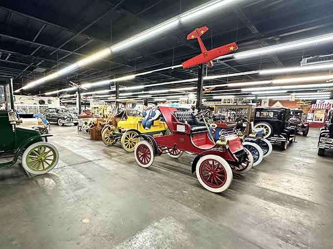 Early automobiles lined up like they're waiting for their close-up in a time machine documentary.