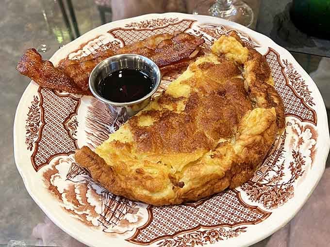 The German Pancake arrives like a golden UFO, puffed and dramatic, ready to make your morning absolutely unforgettable.