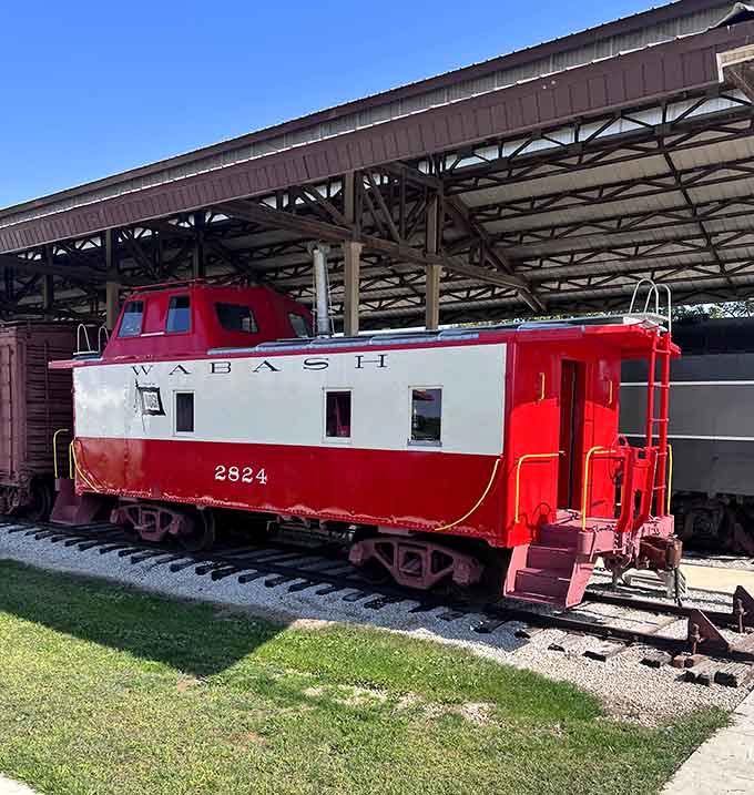That classic Wabash red caboose sitting pretty under the shed is basically the cherry on top of this railroad sundae.