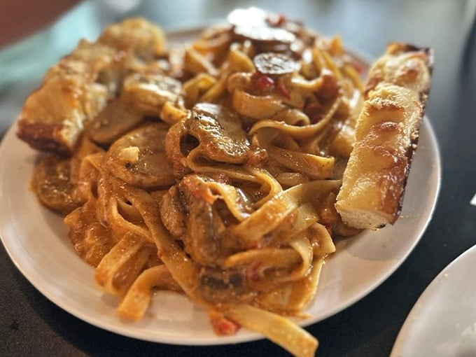 Cajun pasta twirled to perfection, proving this place doesn't just do pizza but does everything with serious commitment.