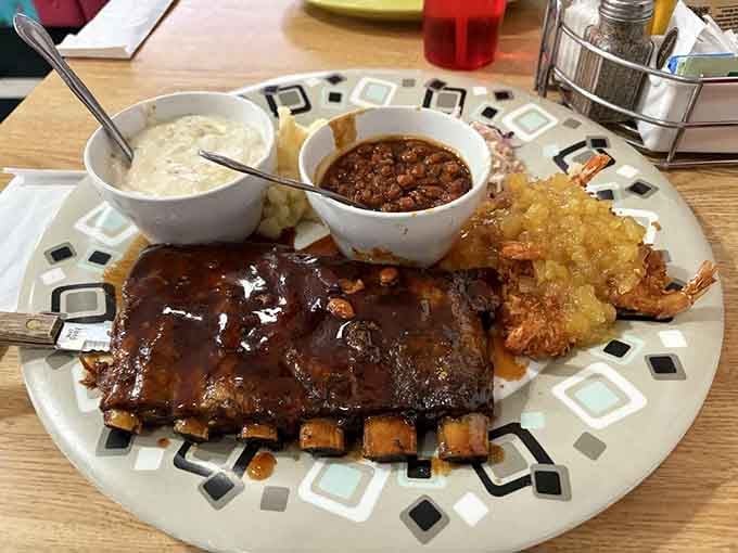 These ribs come slathered in sauce and sided with all the fixings, because subtlety is overrated when barbecue's involved.