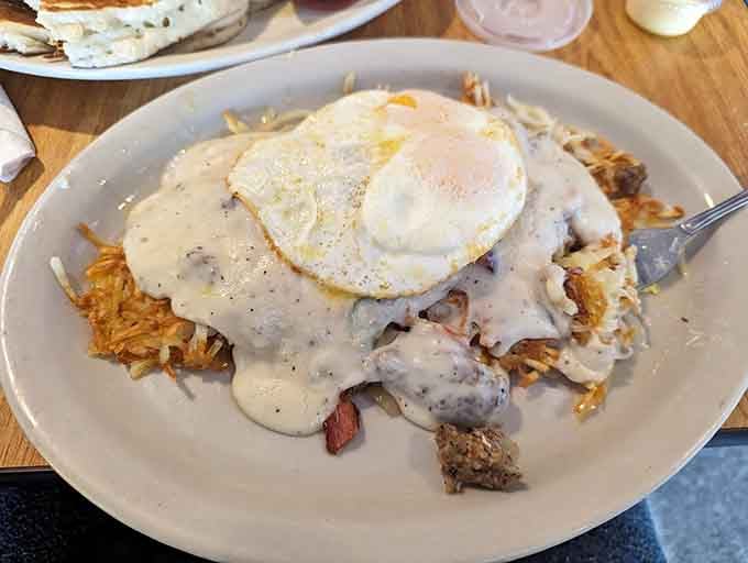 Country fried steak swimming in gravy with crispy hash browns&mdash;this is what comfort food dreams are made of.