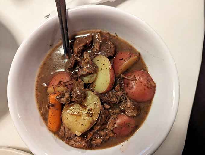 Beef bourguignon with tender vegetables proves Southern cooking can embrace French classics without losing its soul or accent.