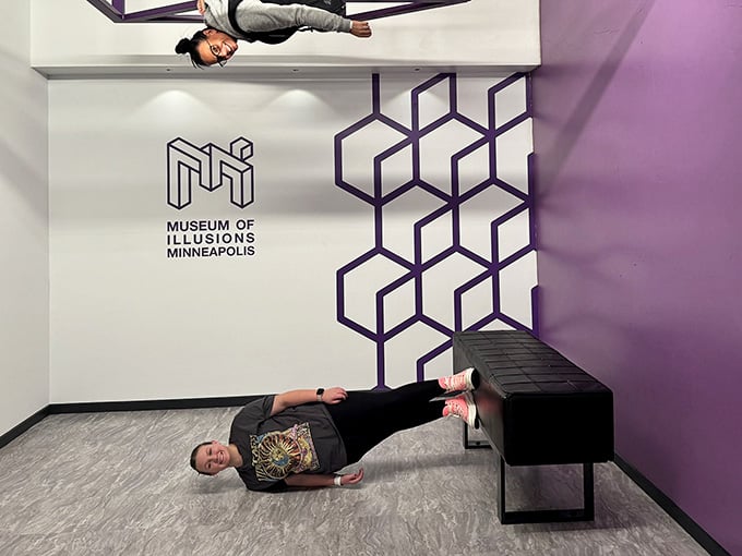 One person chills horizontally while another defies physics vertically, because normal orientation is so last century at this place.