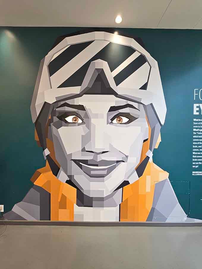 This geometric portrait watches you move through the museum, which is either art or very polite surveillance.